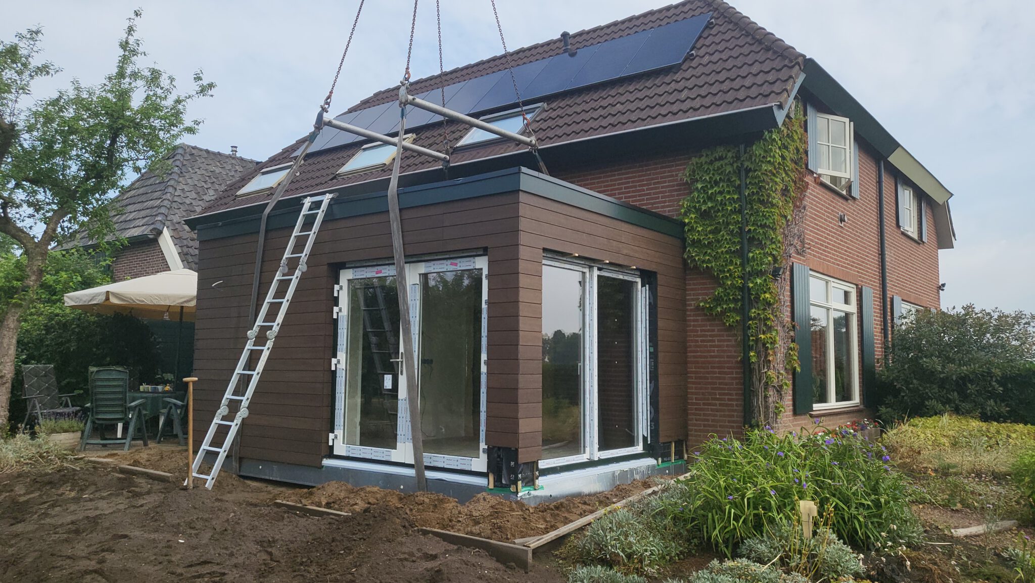 Een prefab uitbouw op maat laten maken, goedkoop en snel.